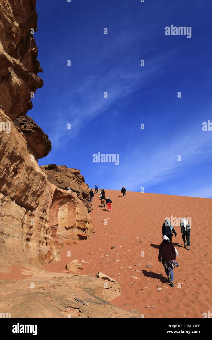 Tourists at Al Ramal Red Sand Dune, Wadi Rum, Unesco World Heritage ...