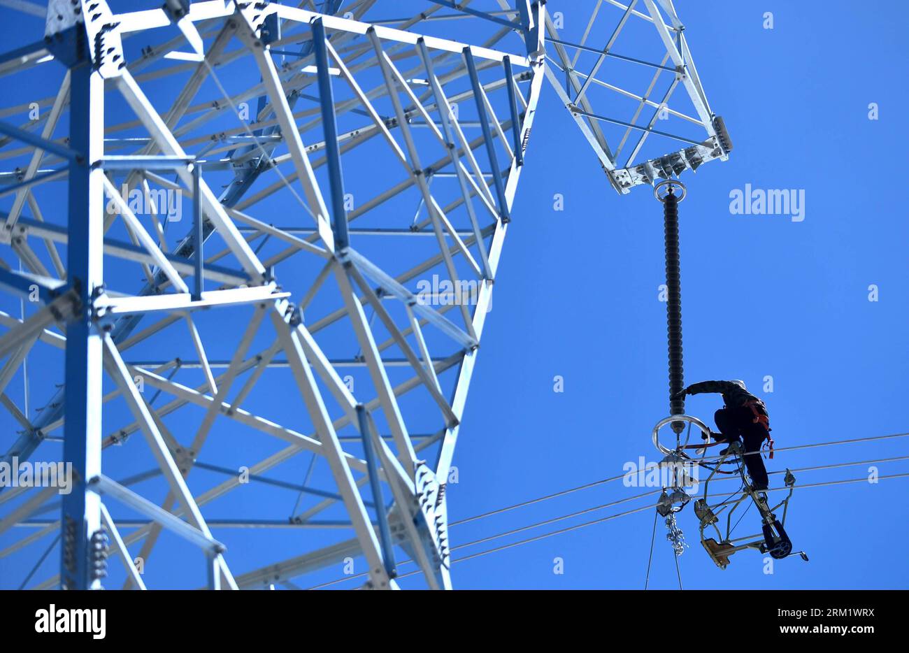 China worker on power tower hi-res stock photography and images - Alamy