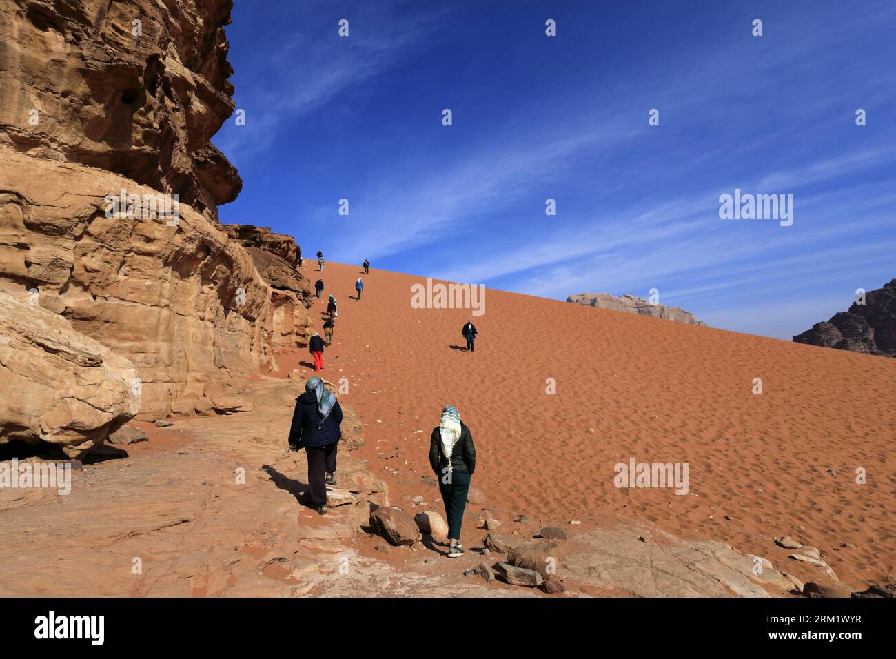 Tourists at Al Ramal Red Sand Dune, Wadi Rum, Unesco World Heritage ...