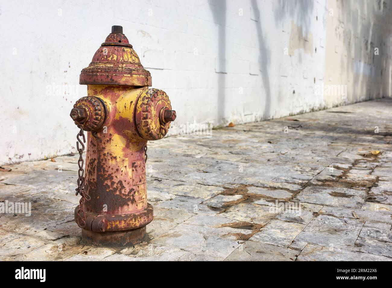 An old rusty fire hydrant on a street of Guayaquil, selective focus ...