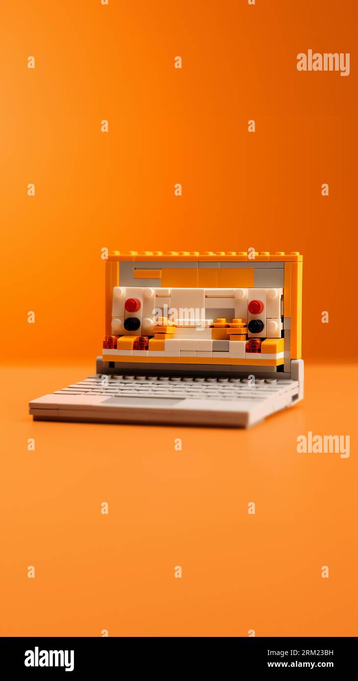 3D Laptop made of plastic block toys with orange color Stock Photo - Alamy