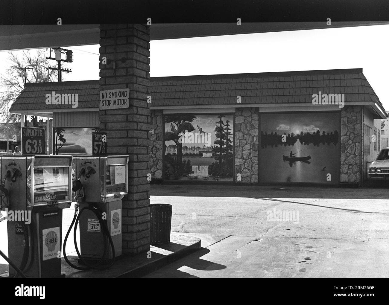 Gas Station, 1970s, with gas pumps and cigarette advertising Stock ...
