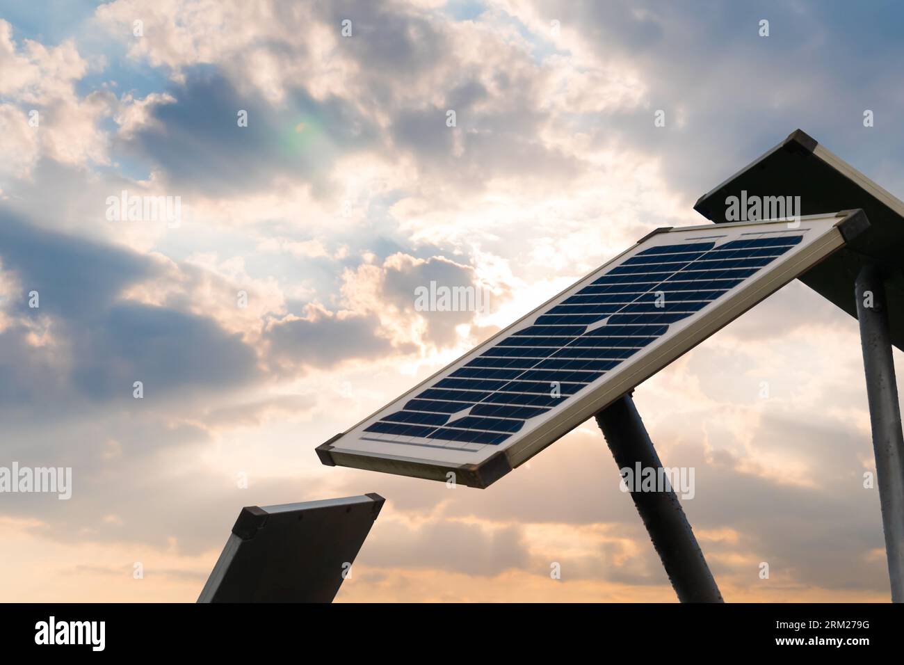 View of solar panel against clouds in the sunset sky - close up Stock ...