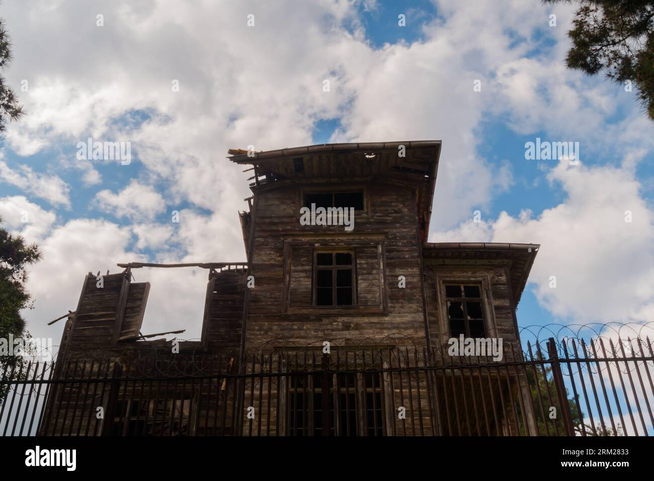 View of white clouds over old ramshackle historic wooden building Stock ...