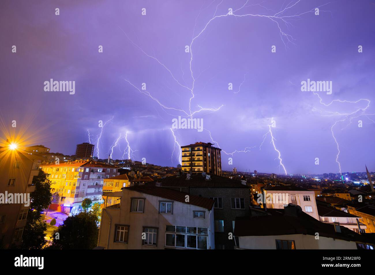View of stormy sky with lightning strikes over the city of Istanbul at ...