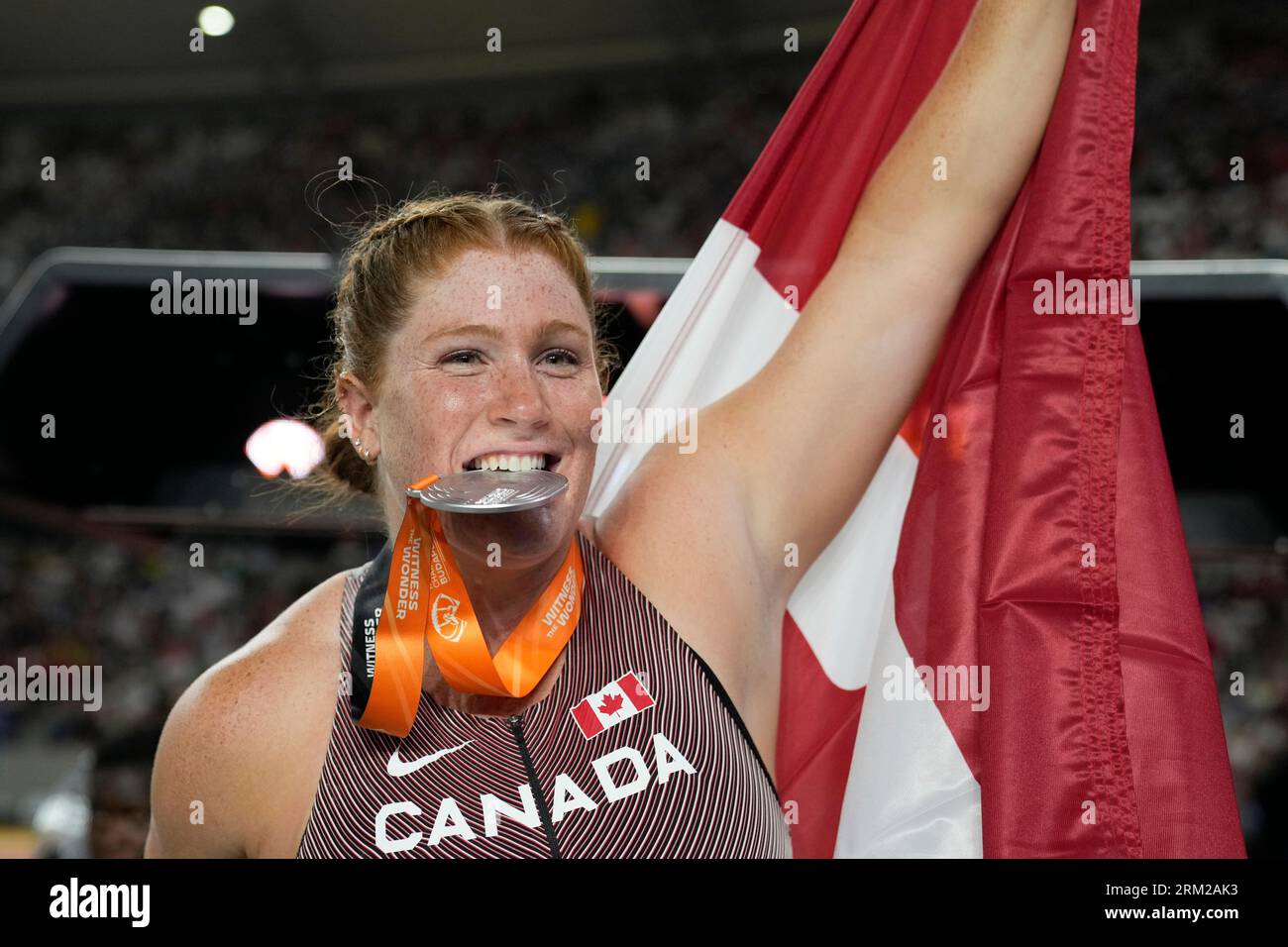 Sarah Mitton, of Canada, poses after after winning the silver medal in ...