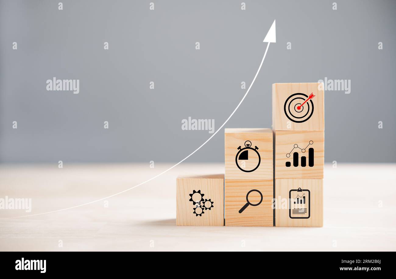 Wooden block cude step on table with Action Plan Stock Photo - Alamy