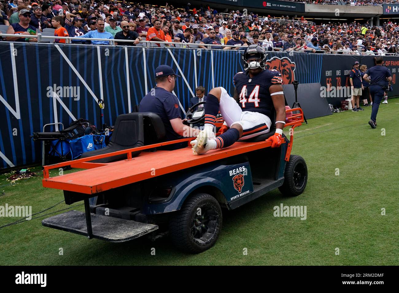Chicago Bears' Noah Sewell is carted off the field during the second ...