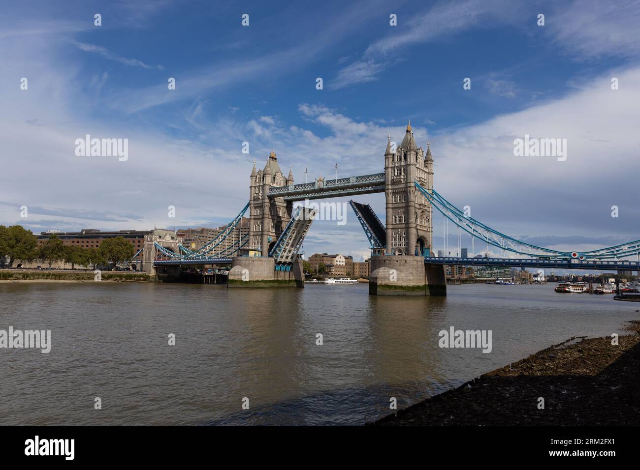 London's iconic Tower Bridge in its raised position Stock Photo - Alamy