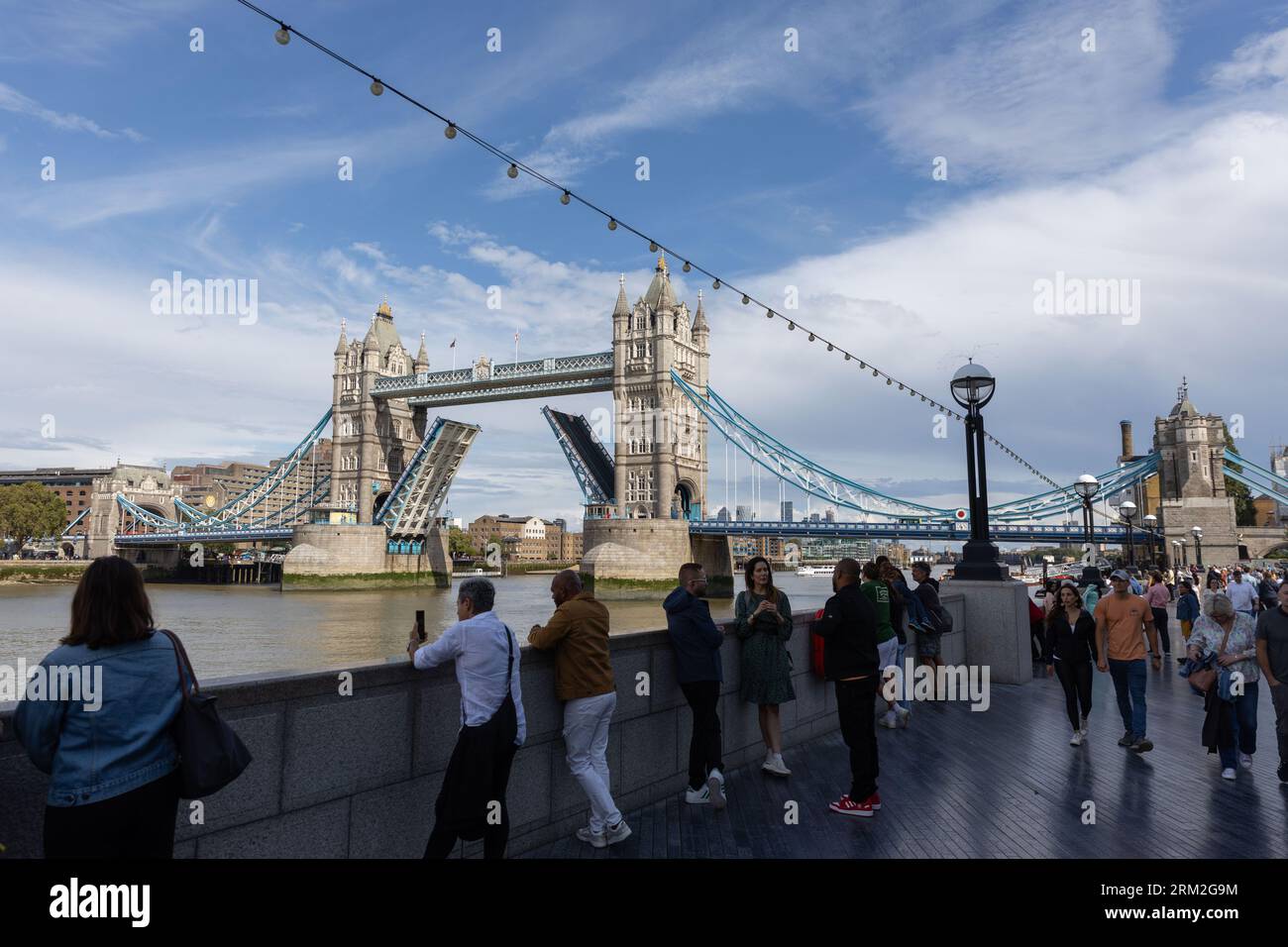 London's iconic Tower Bridge in its raised position Stock Photo - Alamy