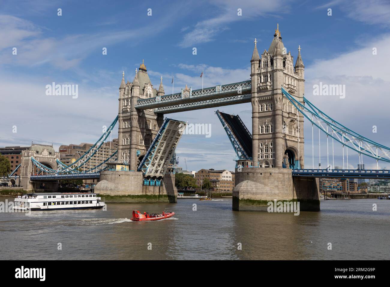 London's iconic Tower Bridge in its raised position Stock Photo - Alamy