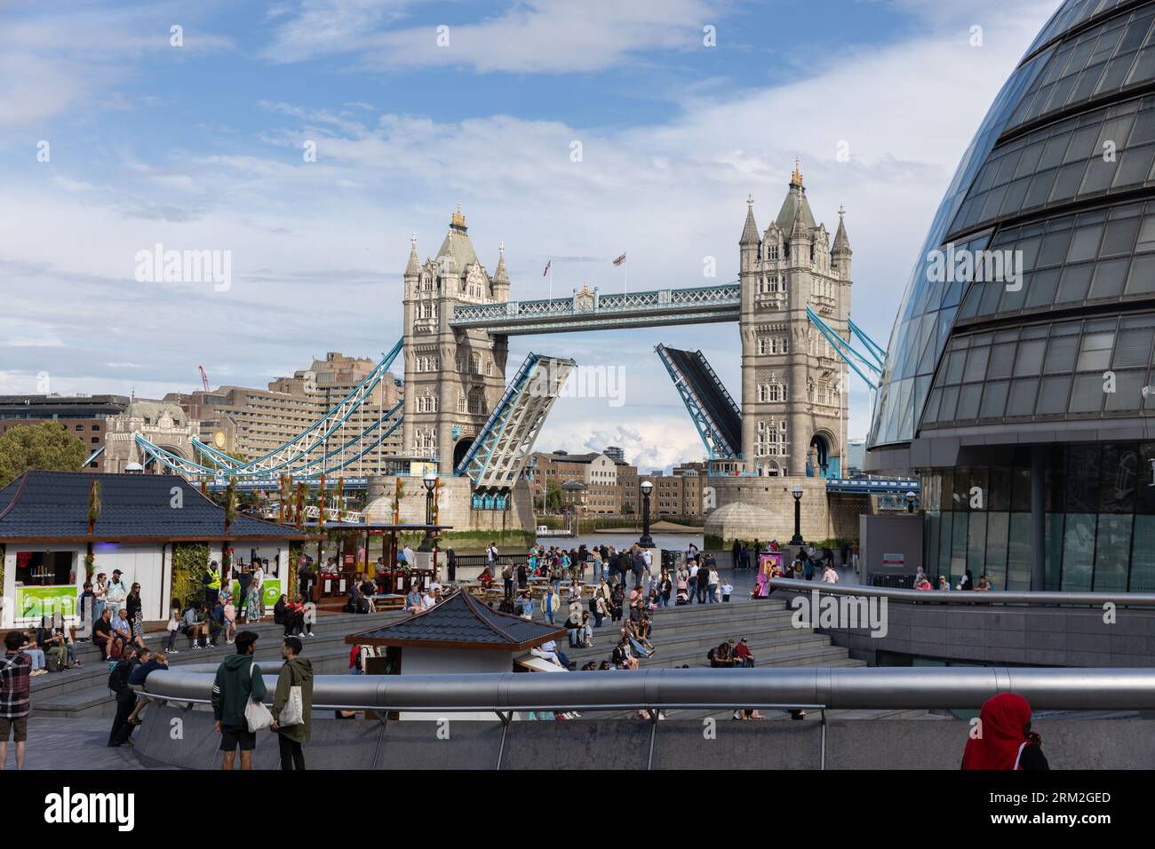 London's iconic Tower Bridge in its raised position Stock Photo - Alamy
