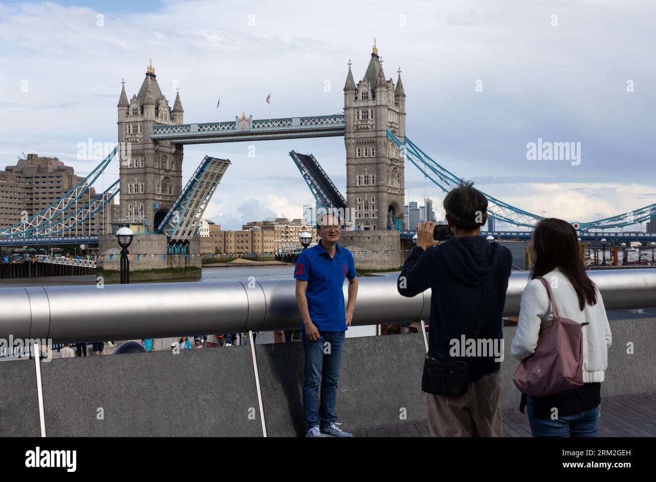 London's iconic Tower Bridge in its raised position Stock Photo - Alamy