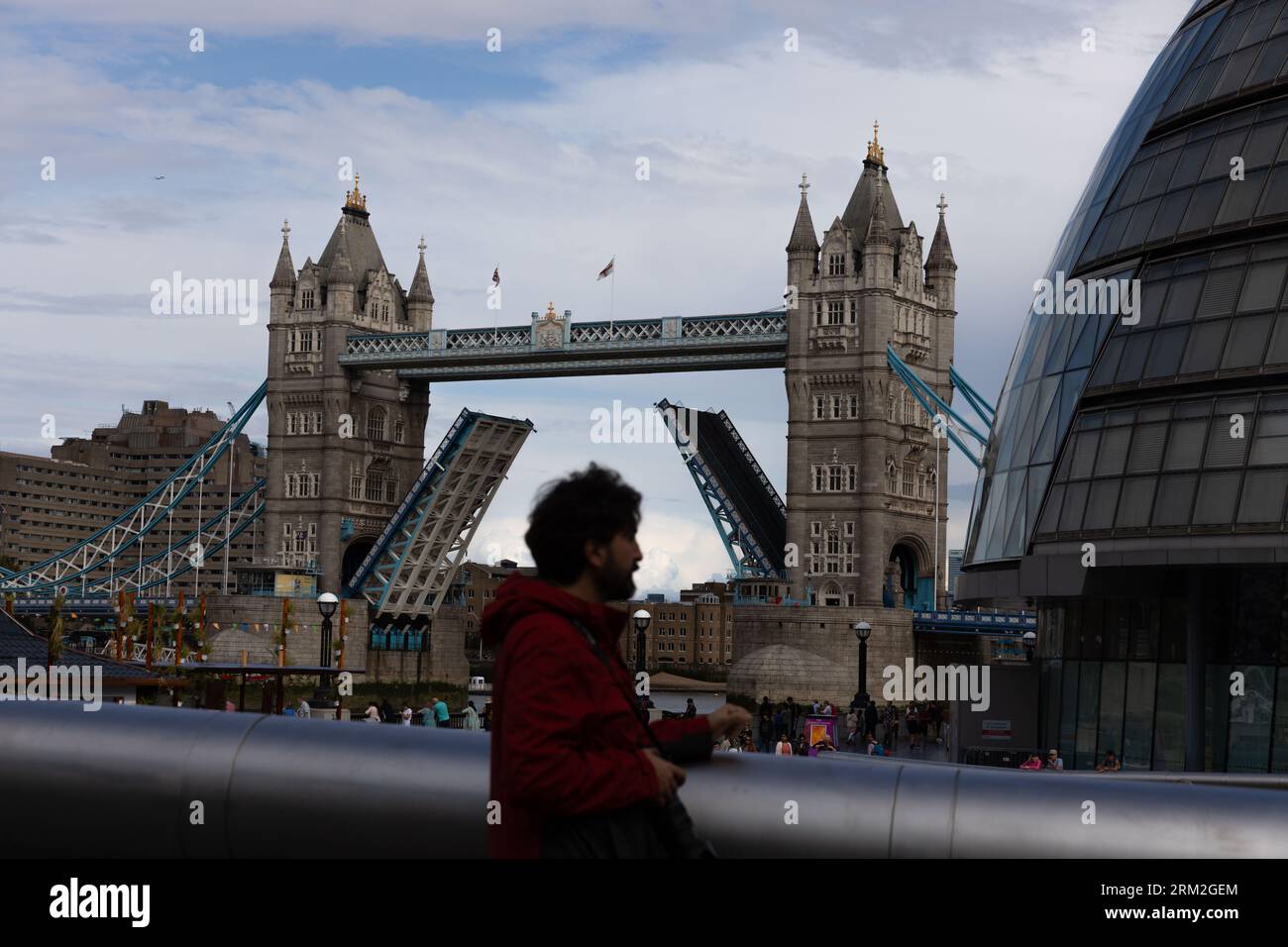 London's iconic Tower Bridge in its raised position Stock Photo - Alamy