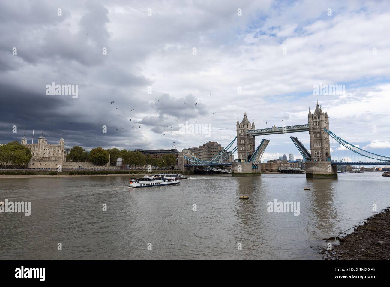 London's iconic Tower Bridge in its raised position Stock Photo - Alamy