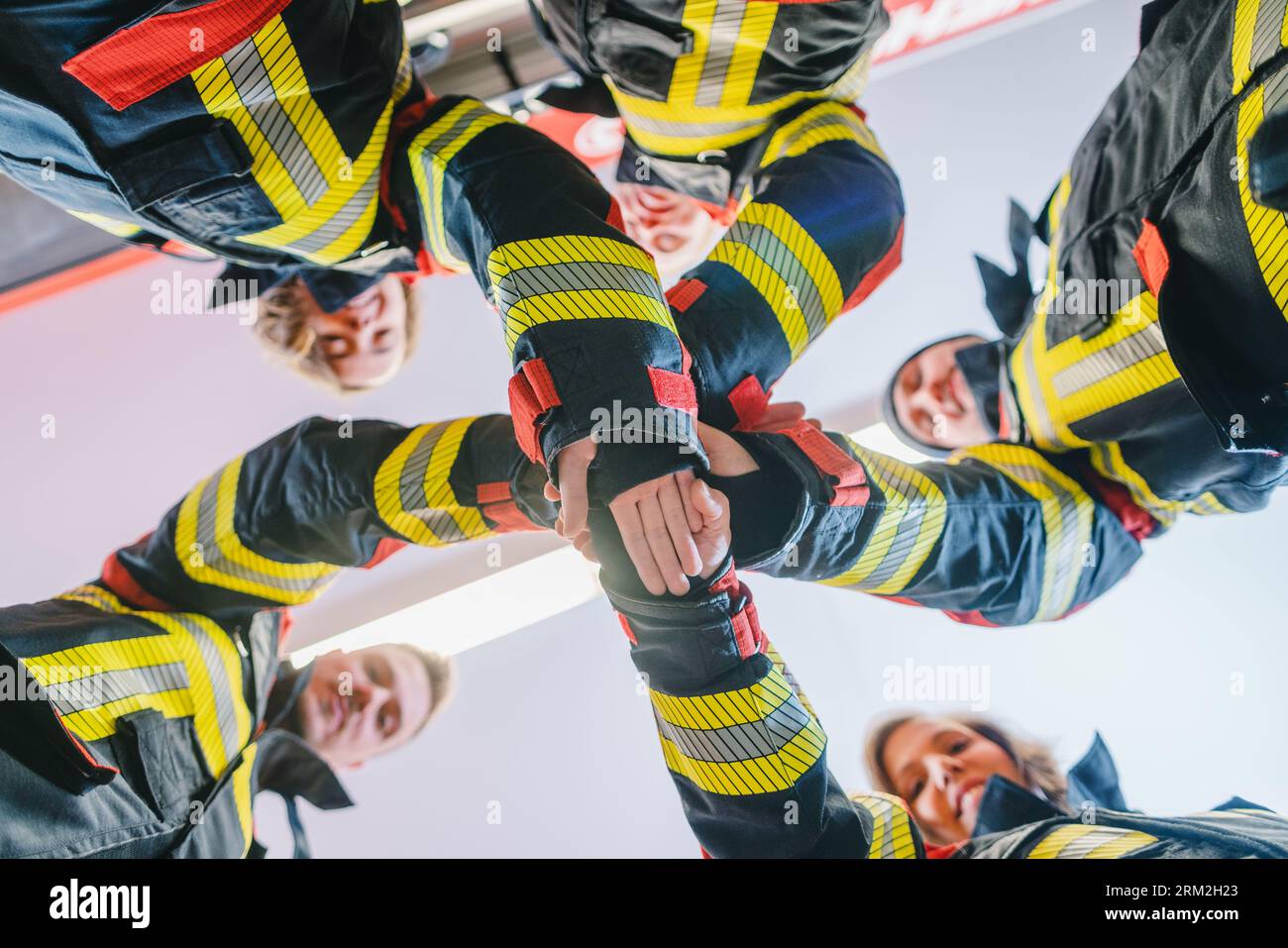 Fire fighter men and women doing some teambuilding Stock Photo - Alamy