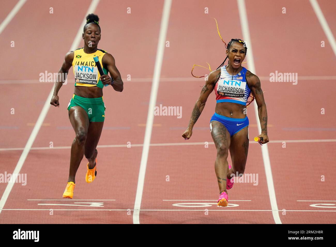 Sha'Carri Richardson, of the United States celebrates anchoring her ...