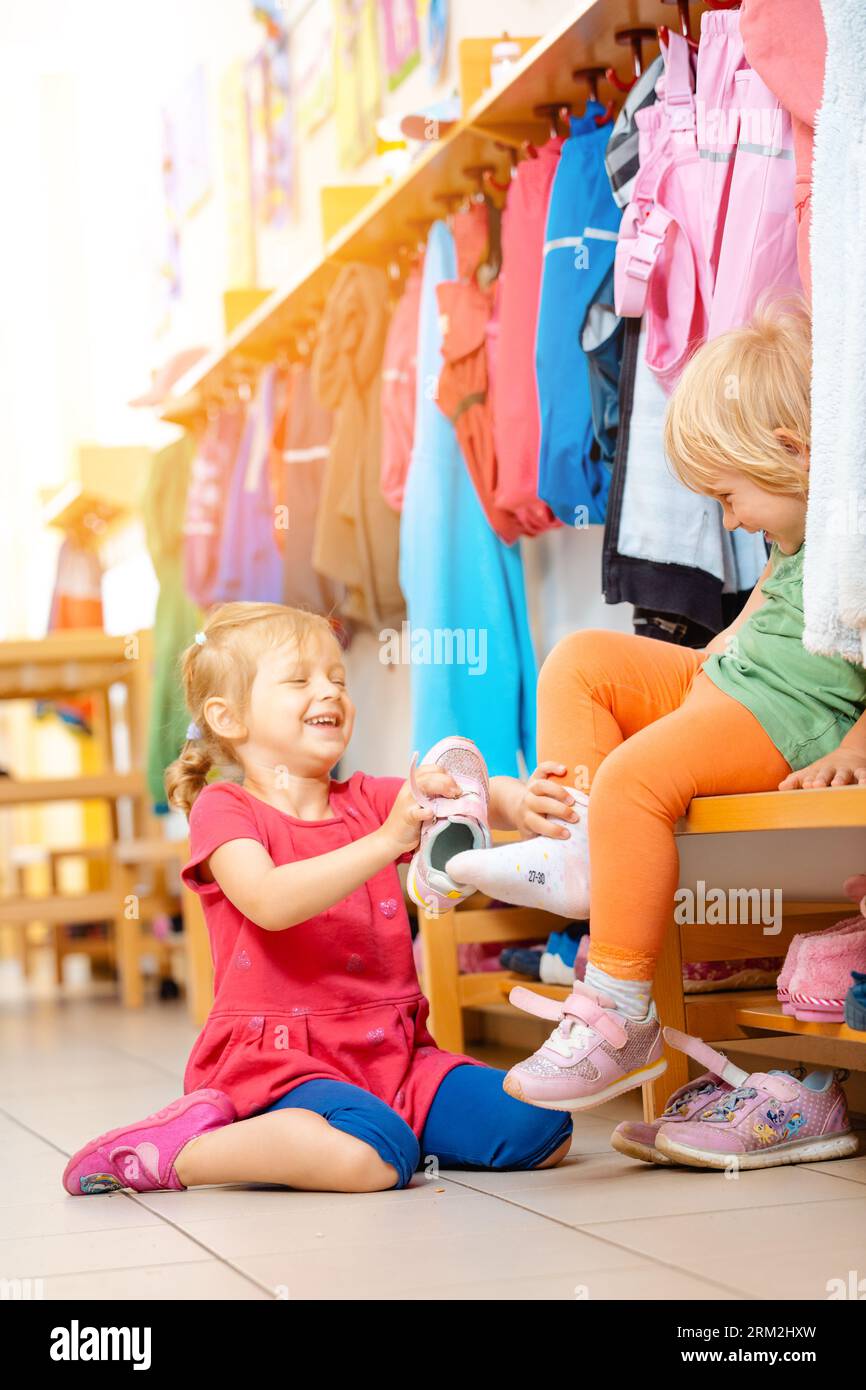 Child getting dressed for school hi-res stock photography and images ...