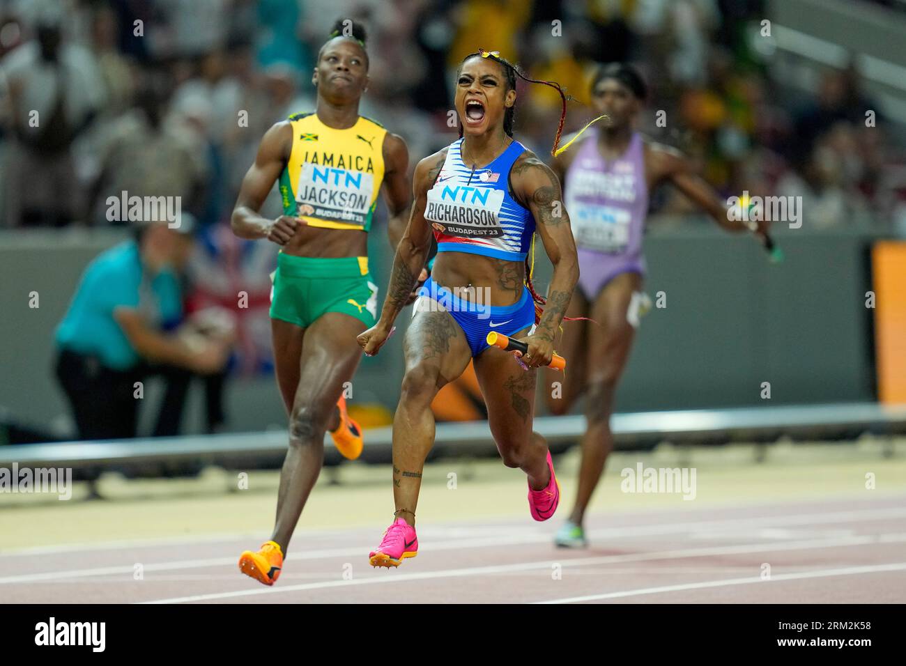Sha'Carri Richardson, of the United States celebrates anchoring her ...