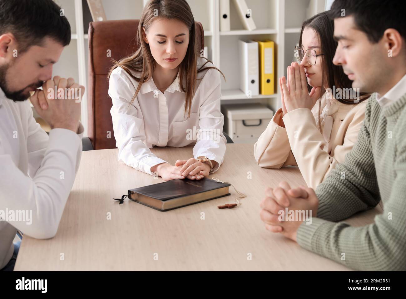 Group business people praying together hi-res stock photography and ...