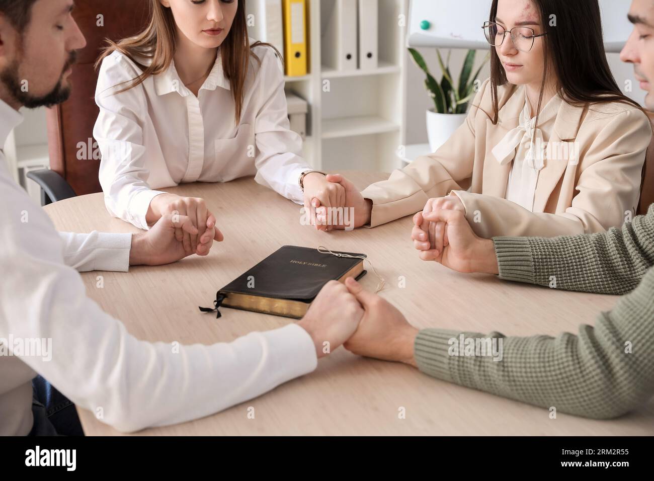 Group business people praying together hi-res stock photography and ...