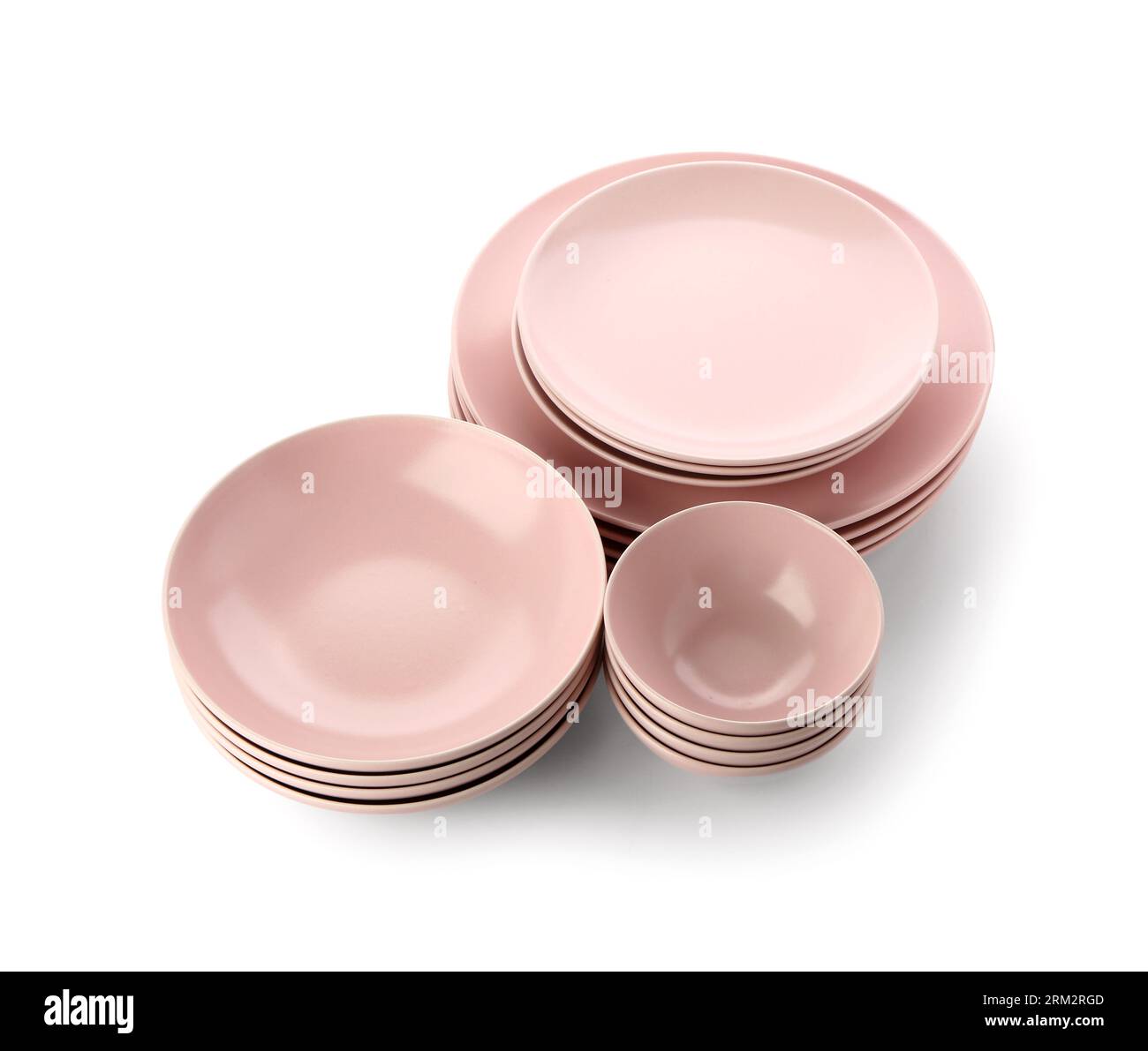 Set of different pink plates on white background Stock Photo - Alamy