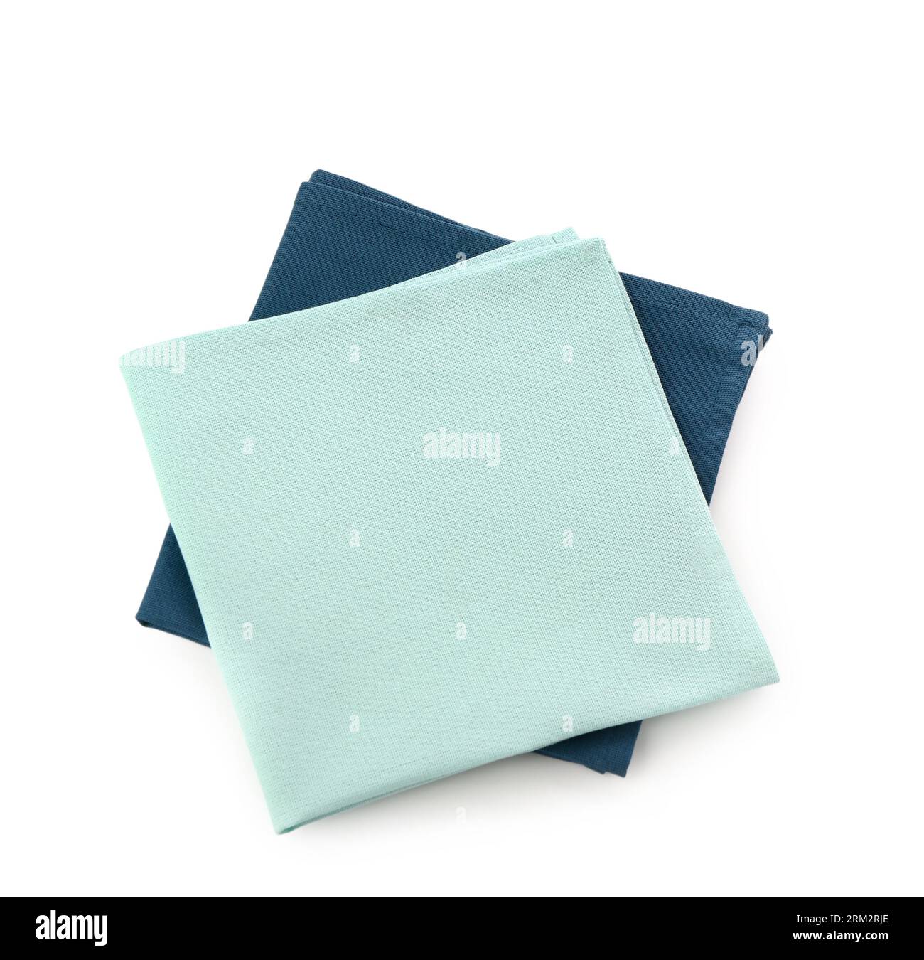 Folded napkins on white background Stock Photo - Alamy