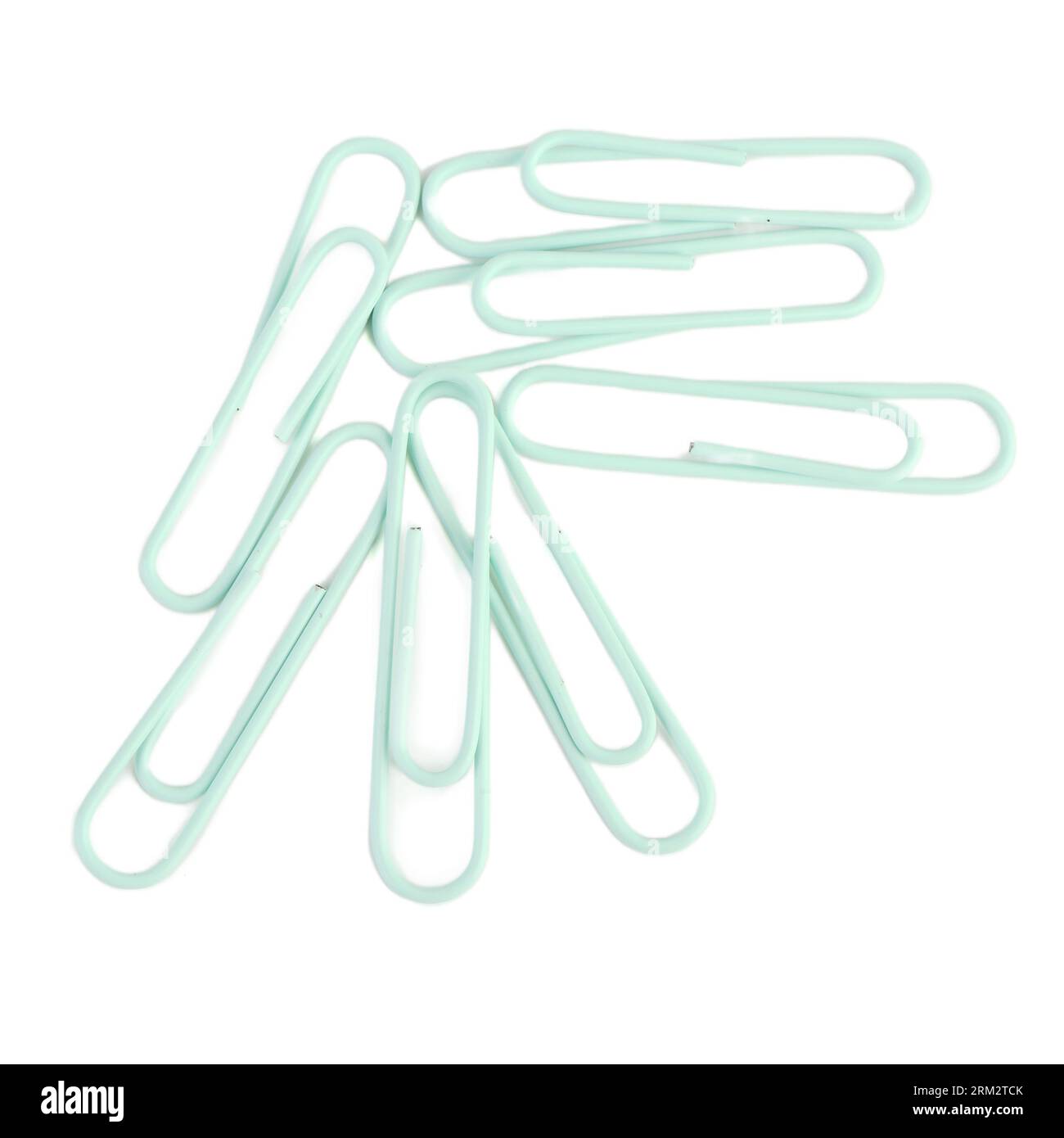 Green paper clips isolated on white background Stock Photo - Alamy