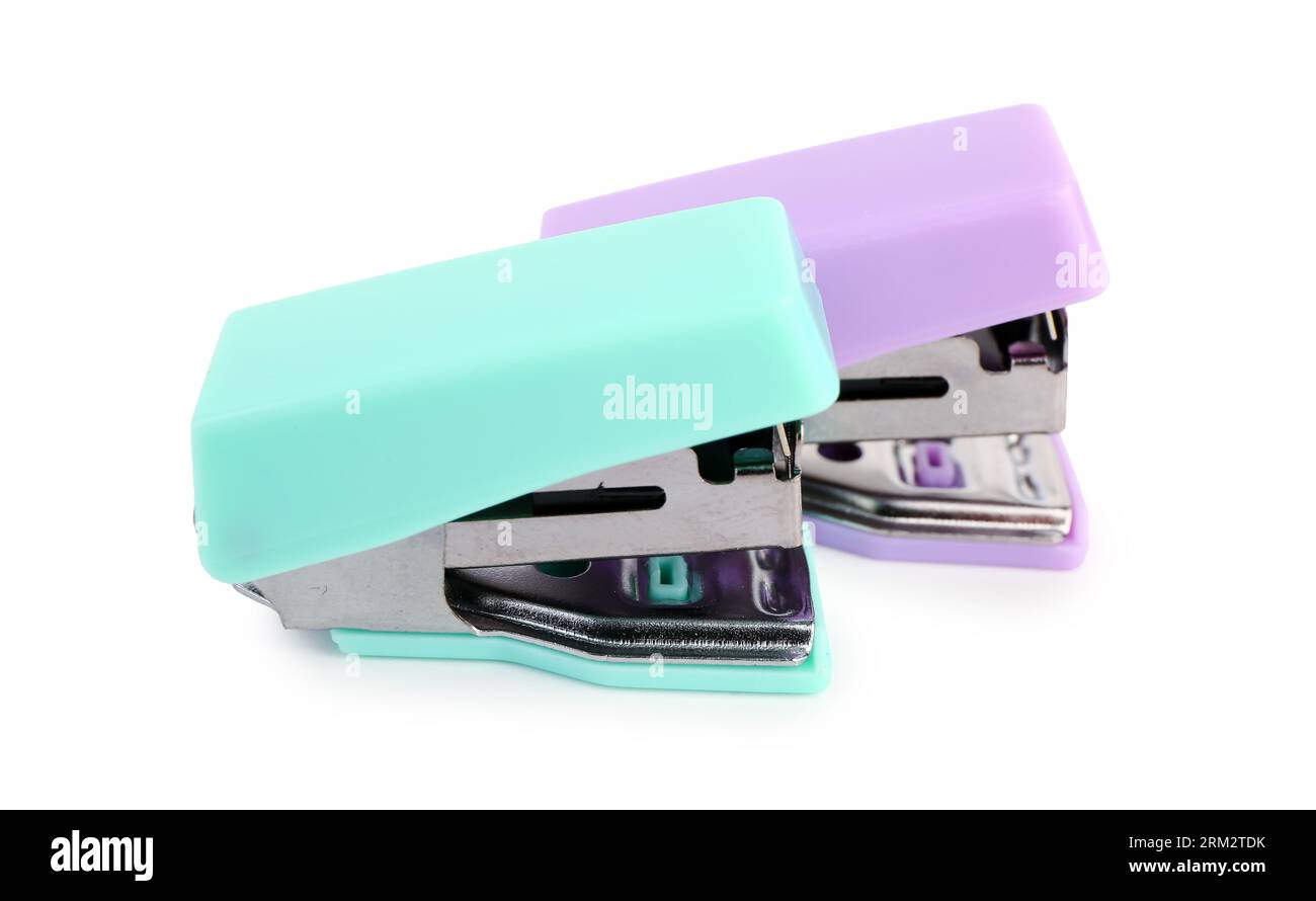 Colorful office isolated staplers on white background Stock Photo - Alamy