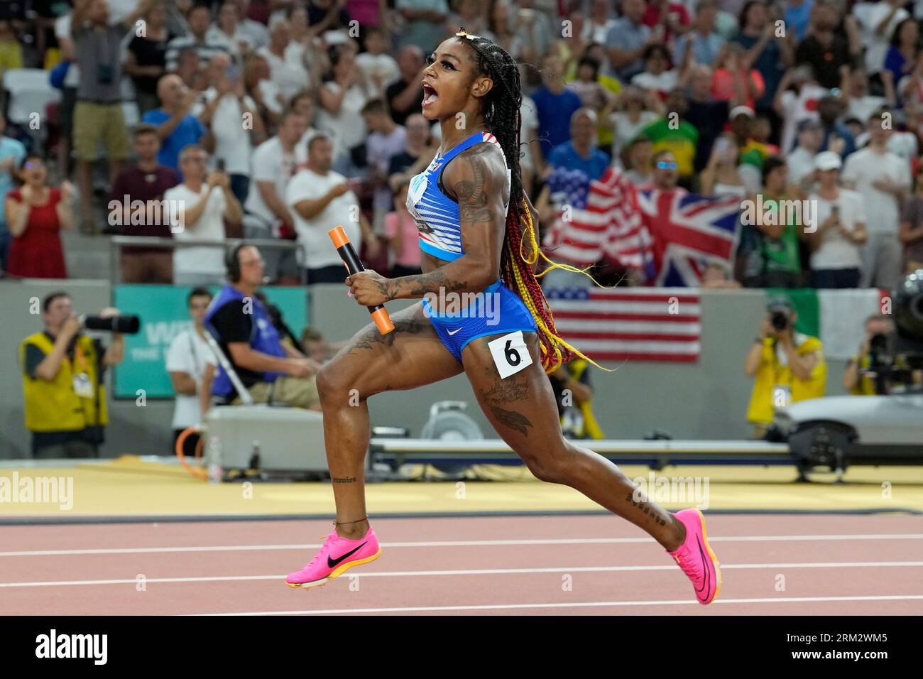 Sha'Carri Richardson, from the United States, crosses the finish line ...