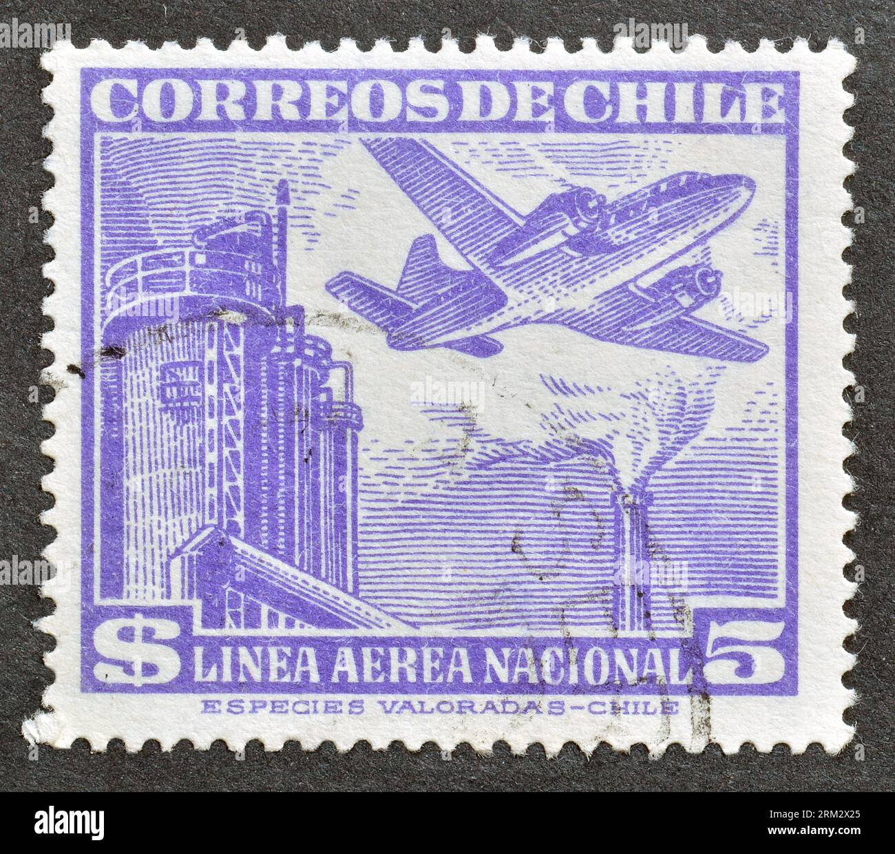 Cancelled postage stamp printed by Chile, that shows Plane over factory ...