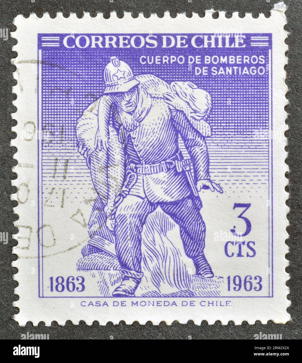 Cancelled postage stamp printed by Chile, that shows Fireman carrying ...