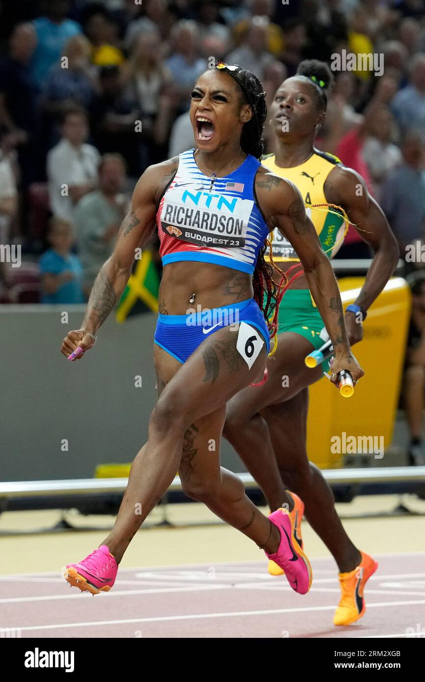 Sha'Carri Richardson, from the United States, crosses the finish line ...