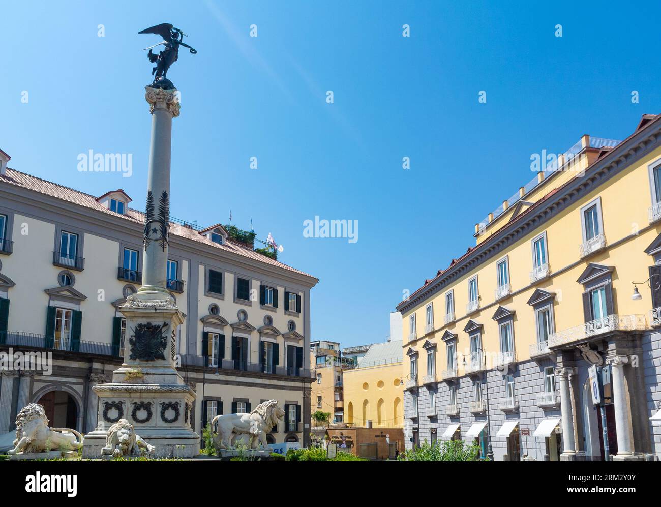 Naples,Italy, A cityscape with classic palace arcitecture and a column ...