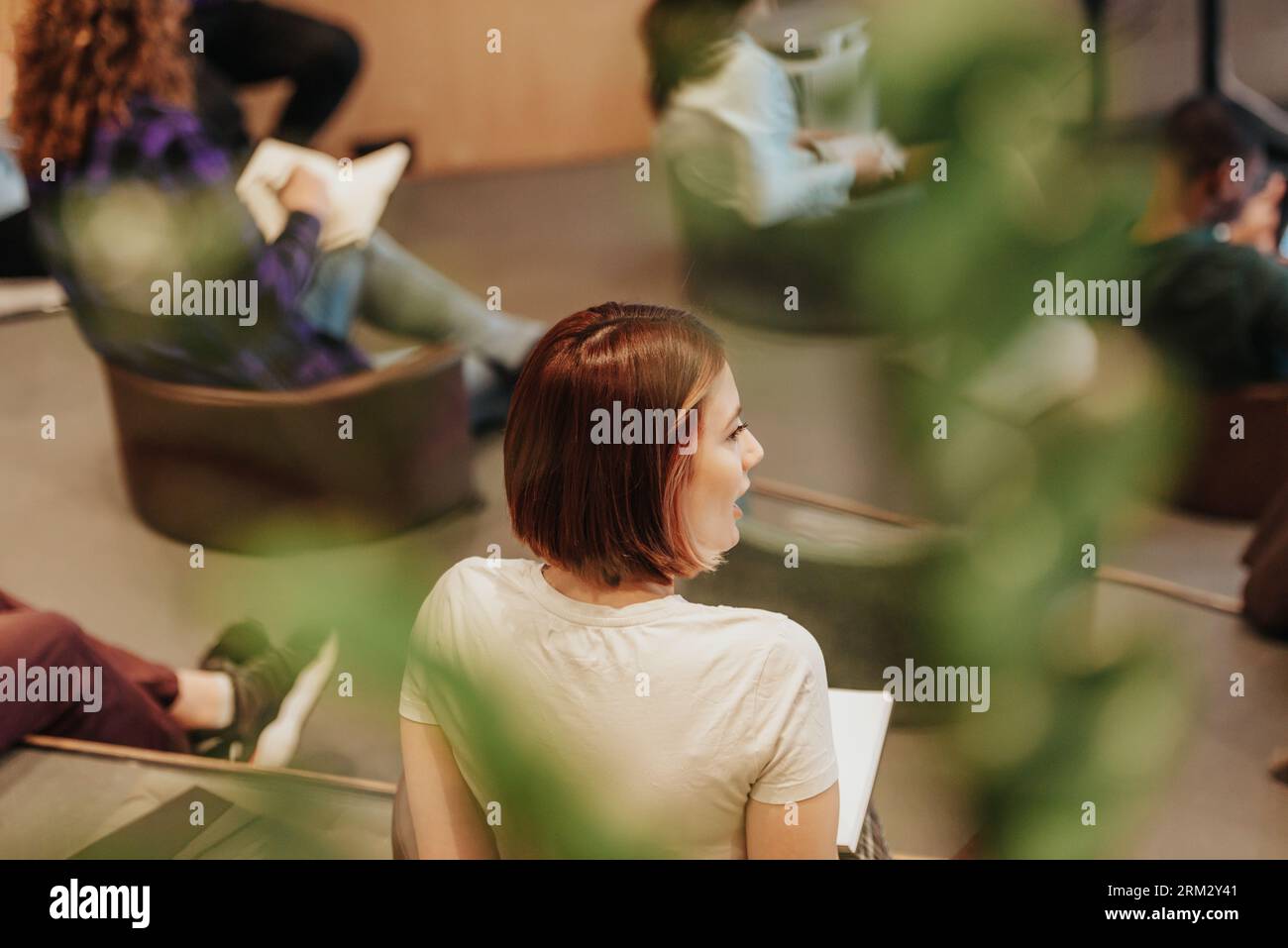 Back view photo of lovely business girl having a conversation with ...