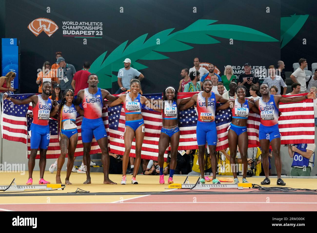 The United States Men's and Women's 4 X 100-meters relay teams pose ...