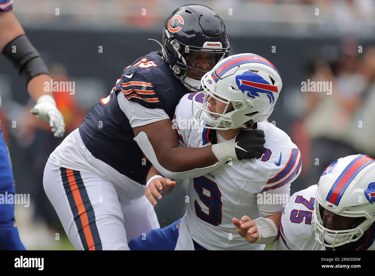 Chicago Bears offensive tackle Josh Lugg (63) tackles Buffalo Bills ...