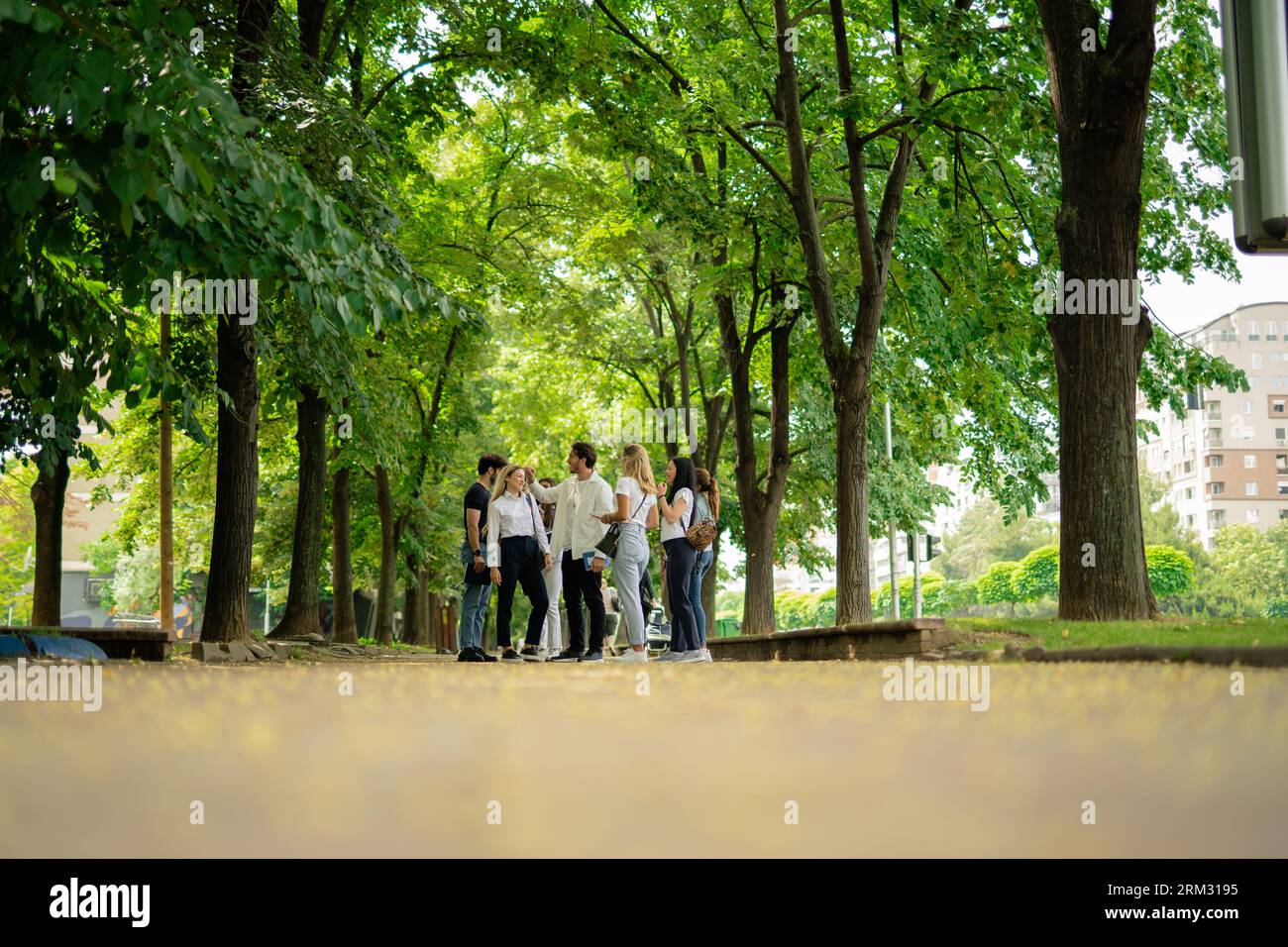 University colleagues walking together in the city, having a ...