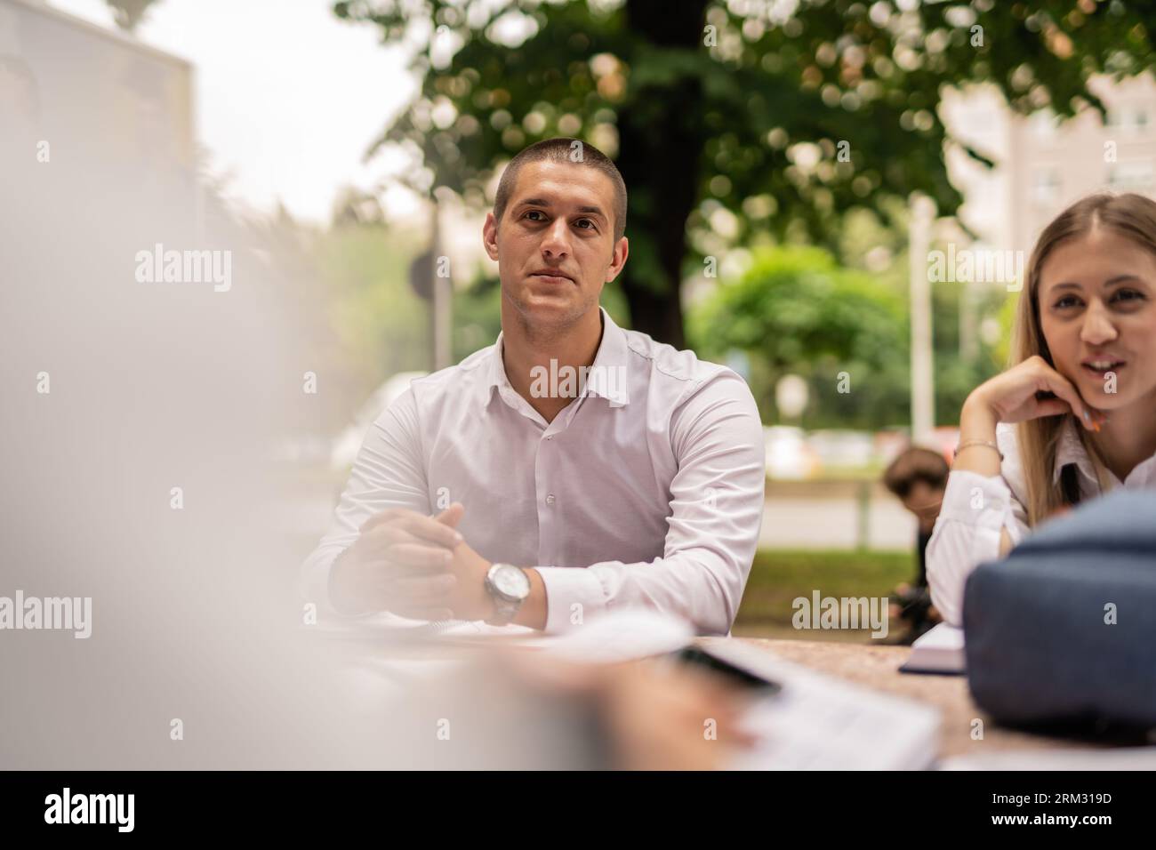 Young students having random conversation during break at school Stock ...