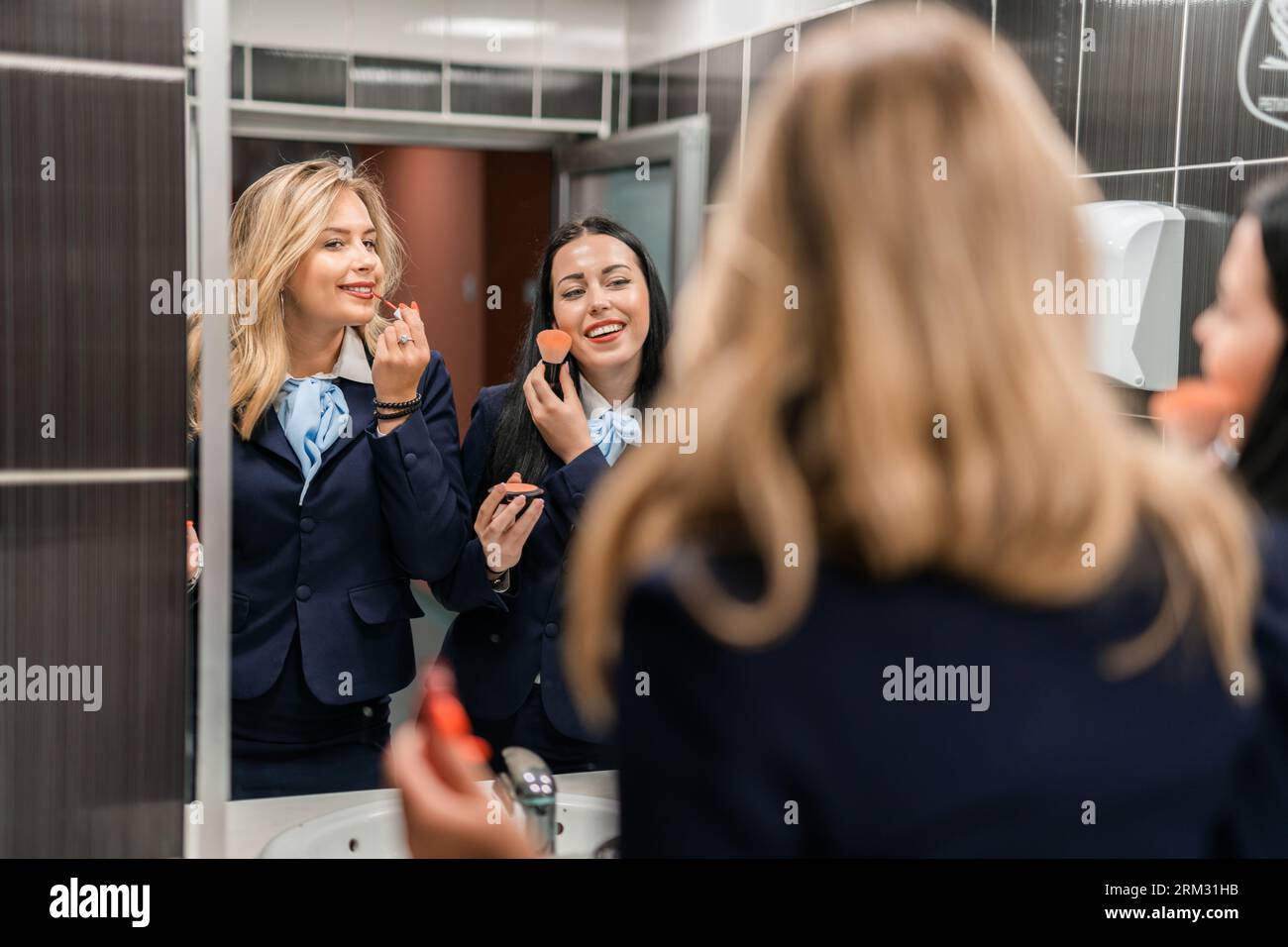 Happy, overjoyed, school girls putting make up on during school break ...
