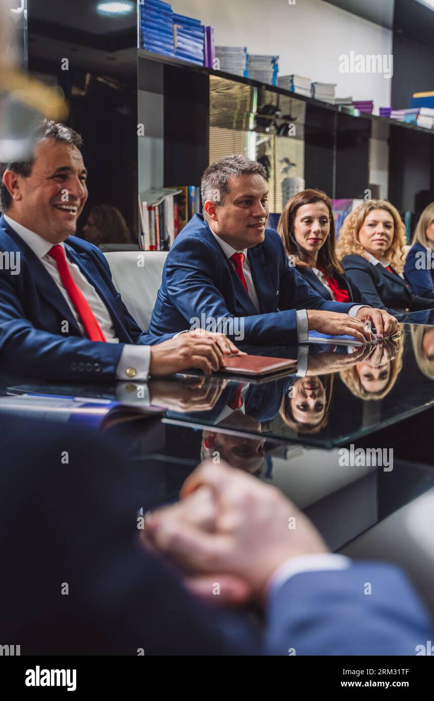 Senior university professors discussing in meeting at the office ...