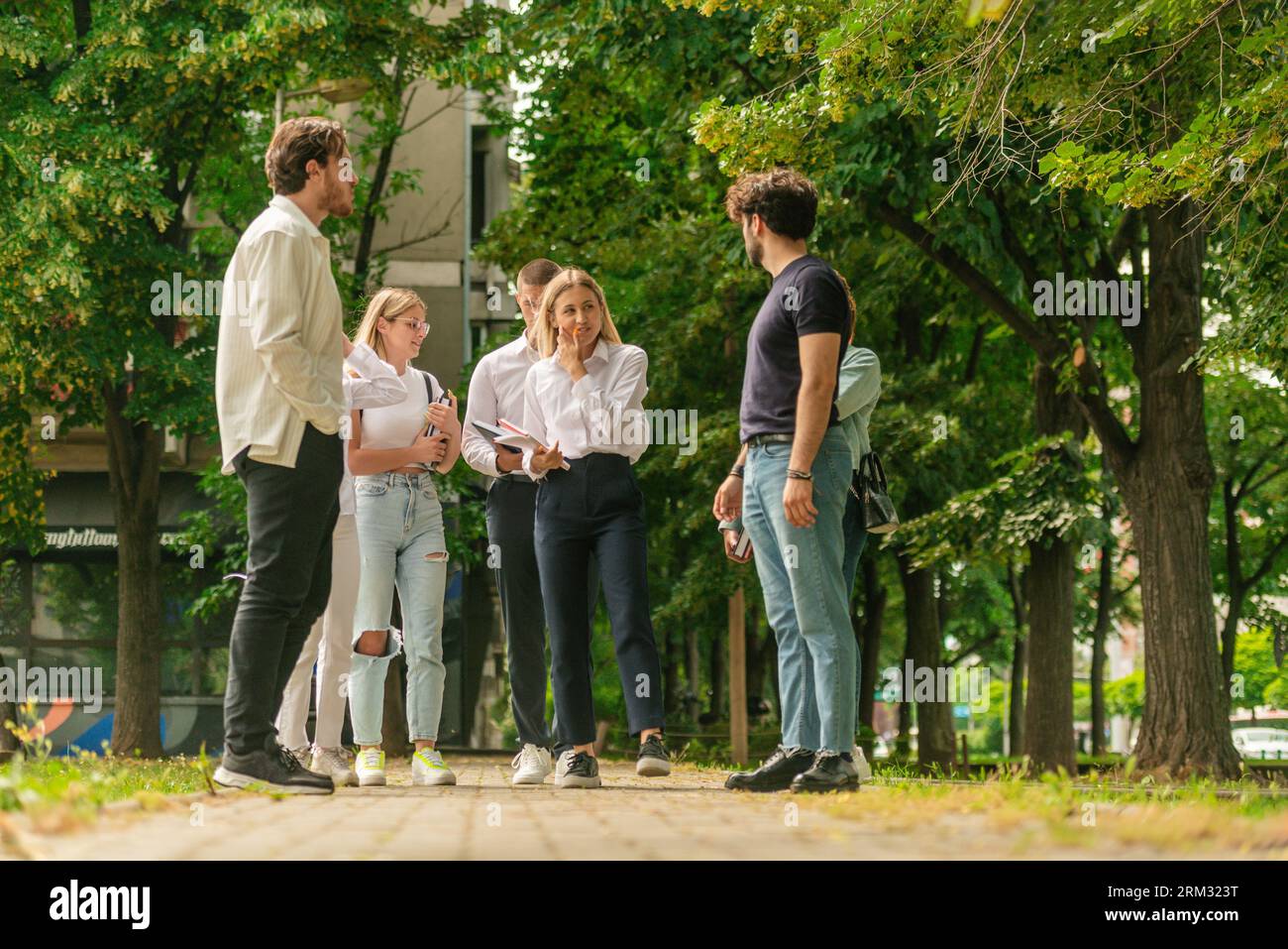 Students talking outside classroom hi-res stock photography and images ...