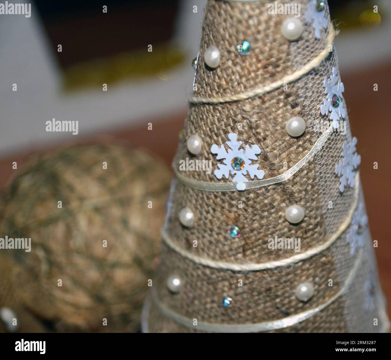 Hand made Christmas tree made of bagging and pearls Stock Photo - Alamy