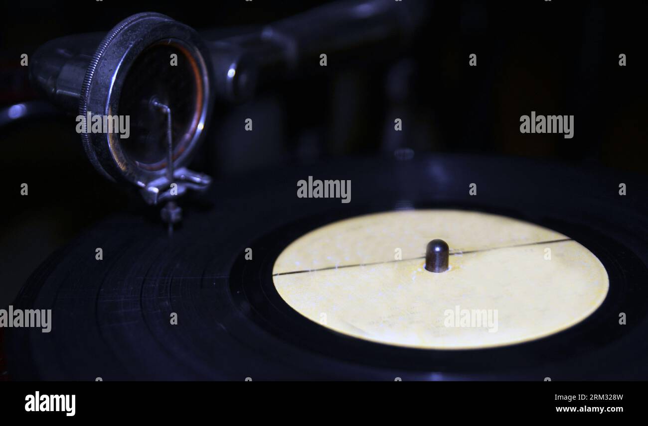Black vinyl disc rotating on a gramophone, retro background Stock Photo ...
