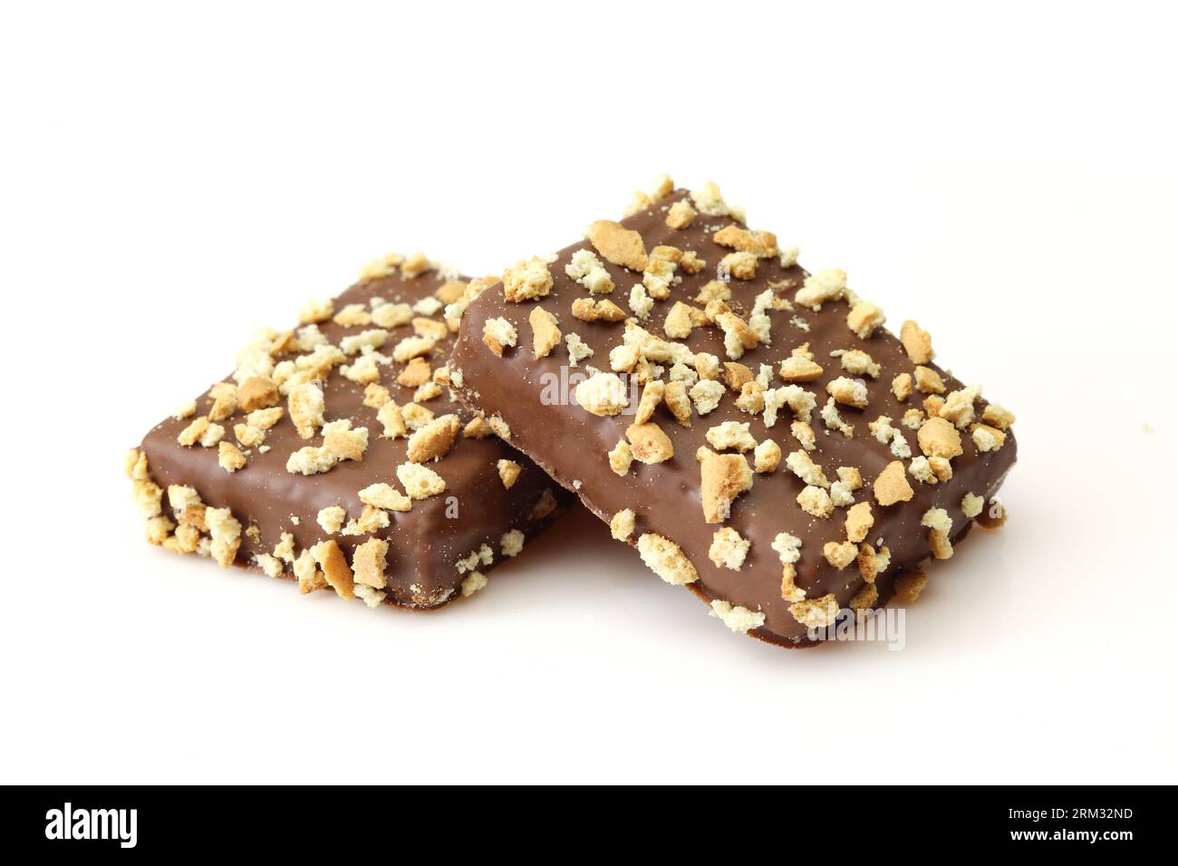 Two chocolate and wafer crumbs covered dessert snack isolated on white ...