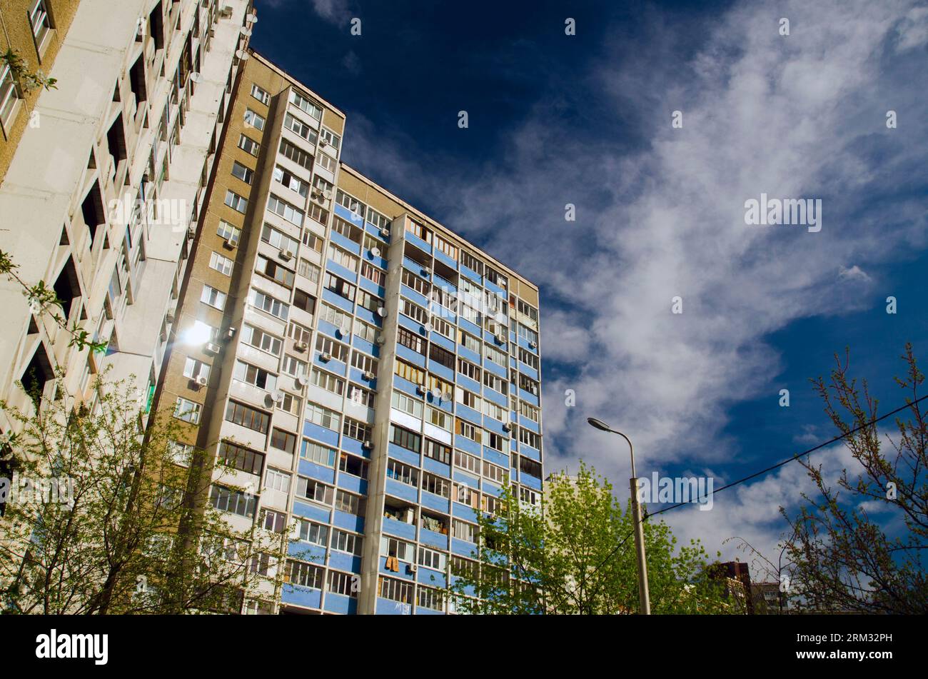 Modern apartment buildings and deep blue sky above them Stock Photo - Alamy
