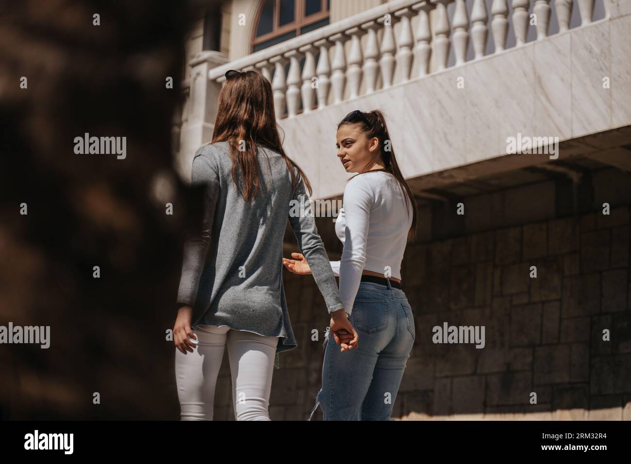 Two beautiful girls laughing talking hi-res stock photography and ...