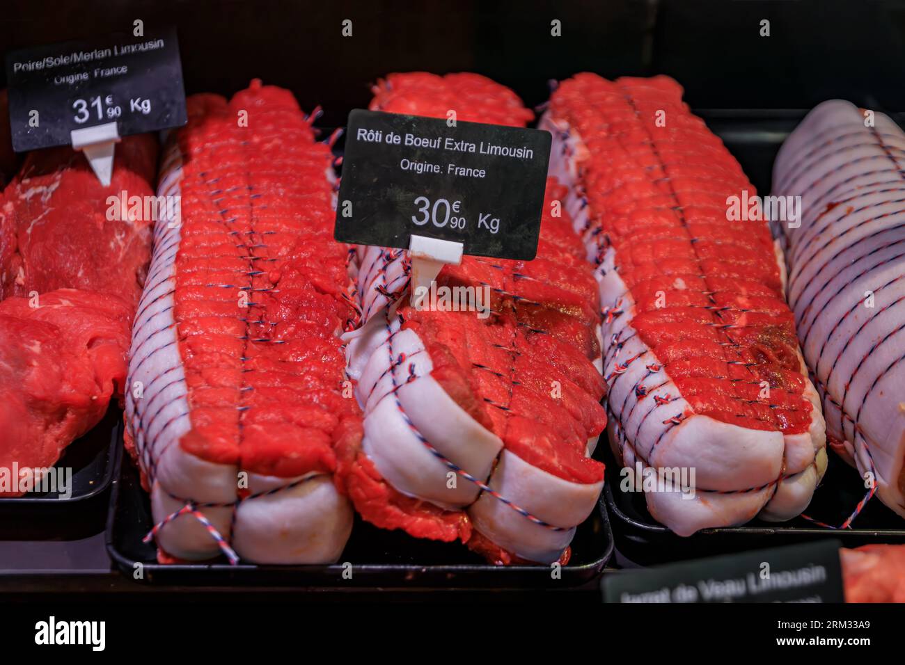 Roast beef on a typical French butcher shop counter at a local farmers ...