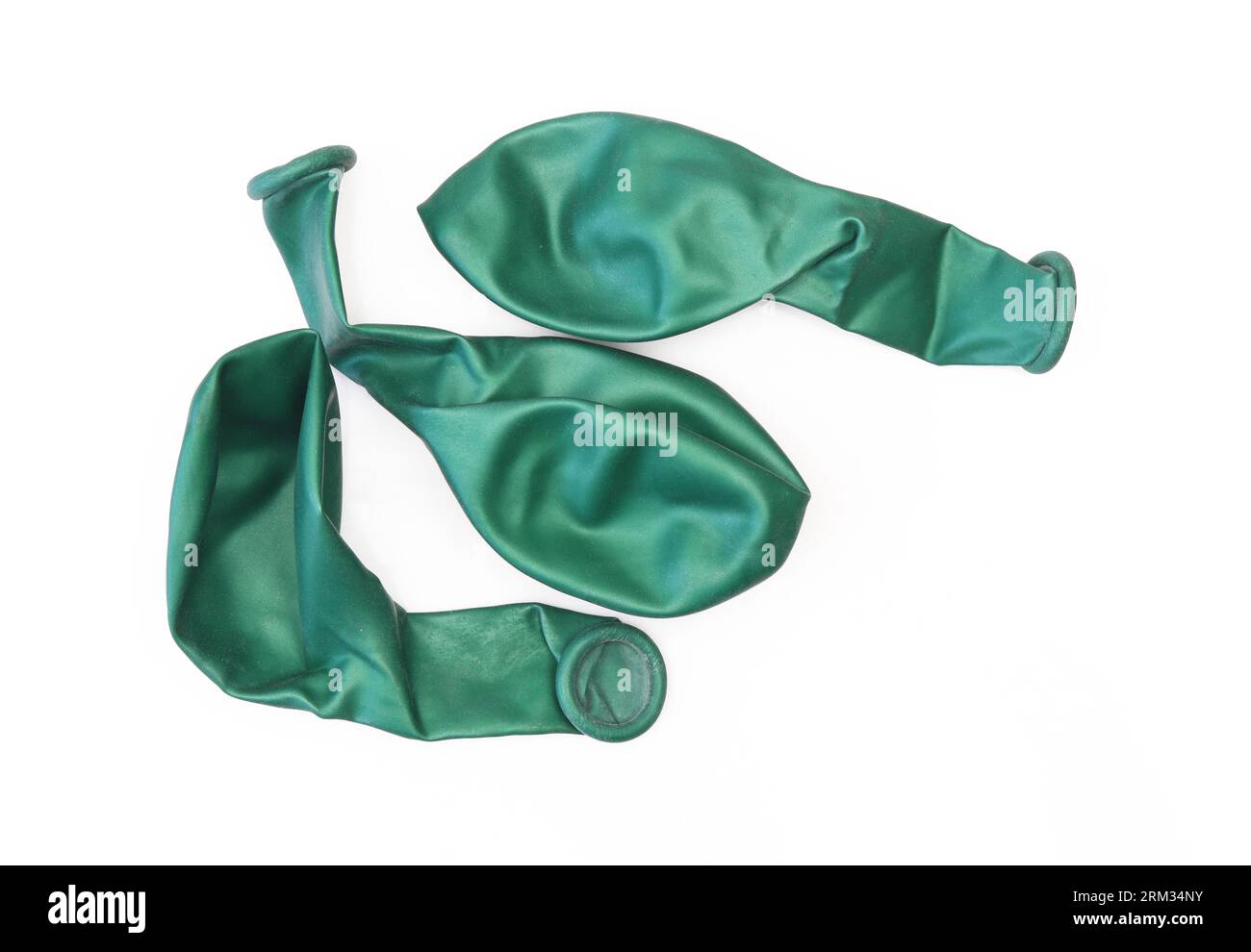 Three deflated decorative green balloons isolated on white background ...