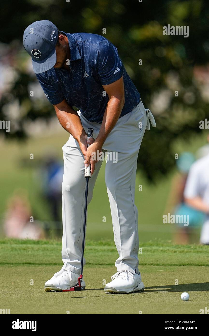 Xander Schauffele putts on the fifth green during the third round of ...